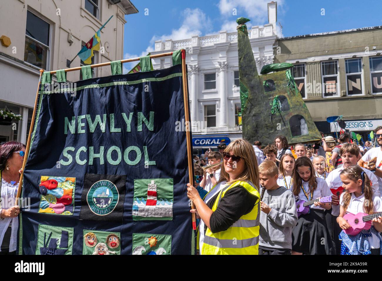 Adults and school children from Newlyn School playing instruments ...