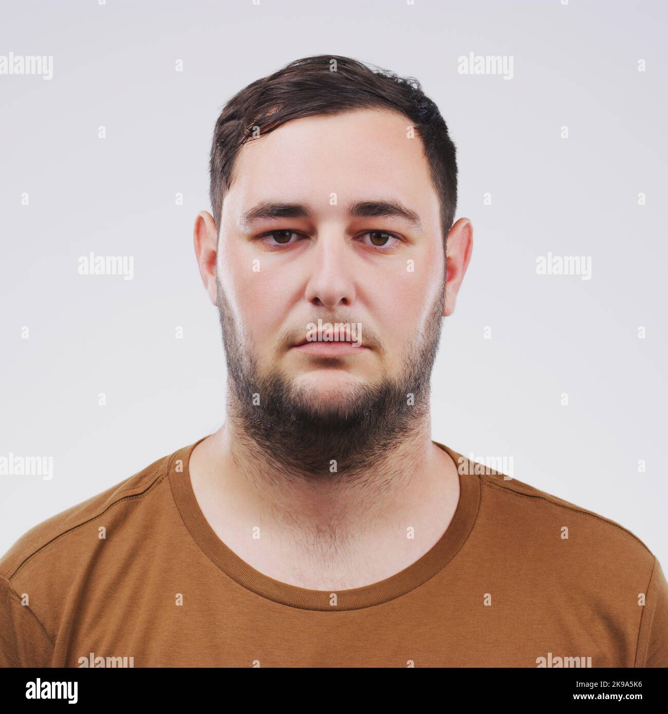 He gives nothing away. Studio portrait of a handsome young man posing ...