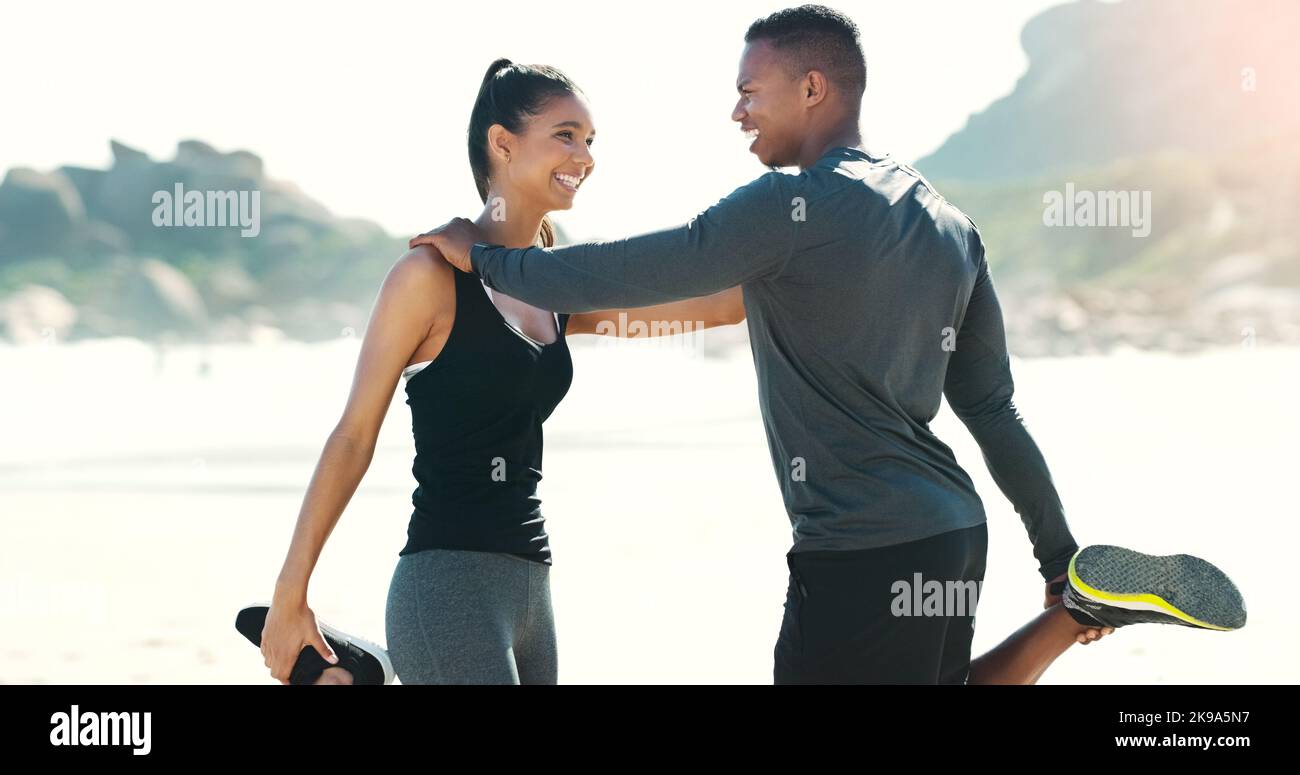 Workouts work better with bae. a happy young couple stretching while ...