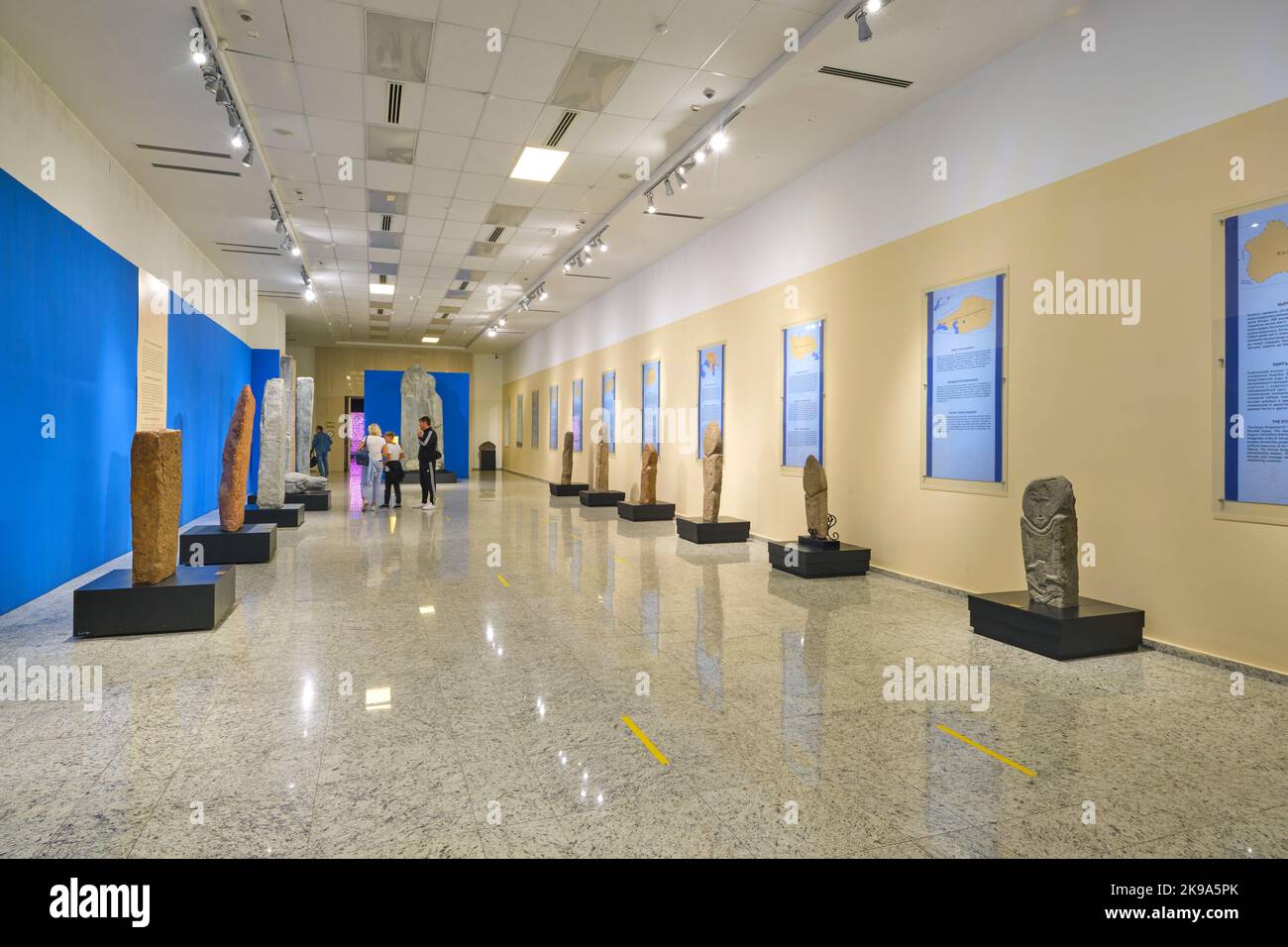 A gallery showing old, stone, carved figures, possible grave markers or ...