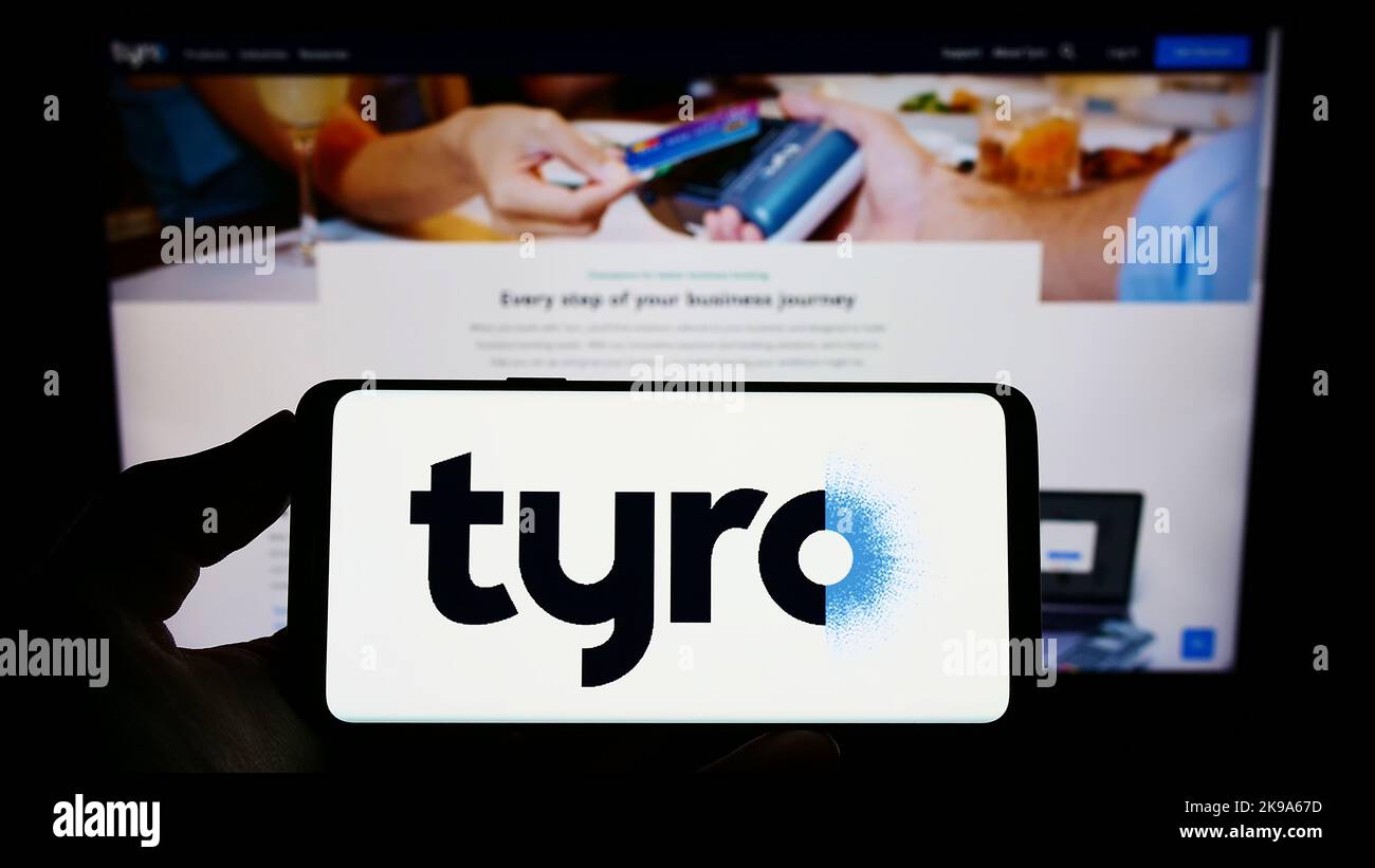 Person holding smartphone with logo of Australian fintech company Tyro ...