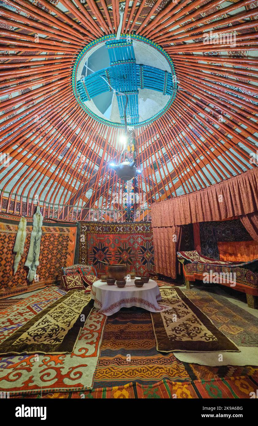 Inside view of a full scale model of a yurt, featuring many rich ...