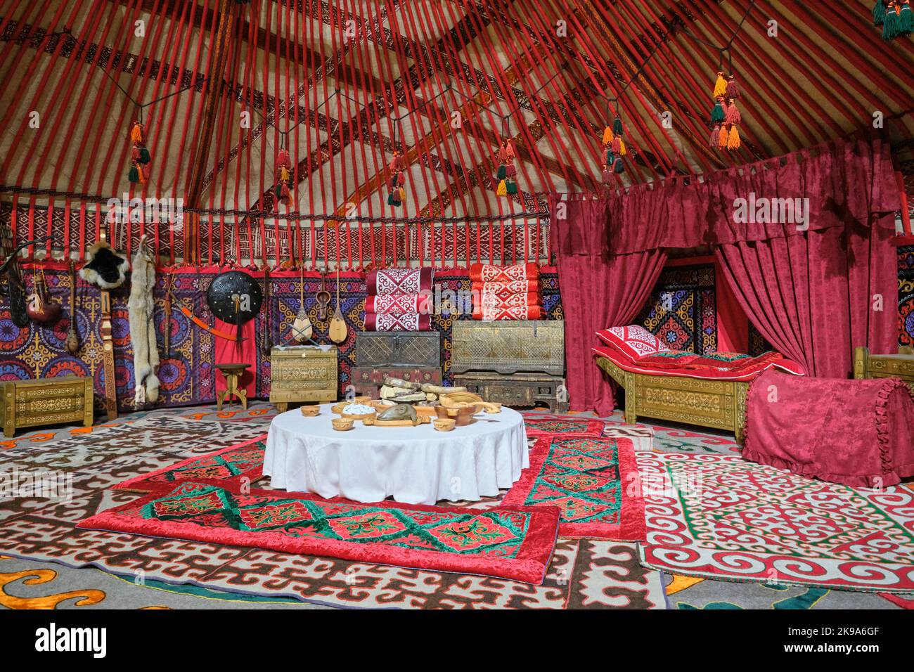 Inside view of a full scale model of a yurt, featuring many rich ...