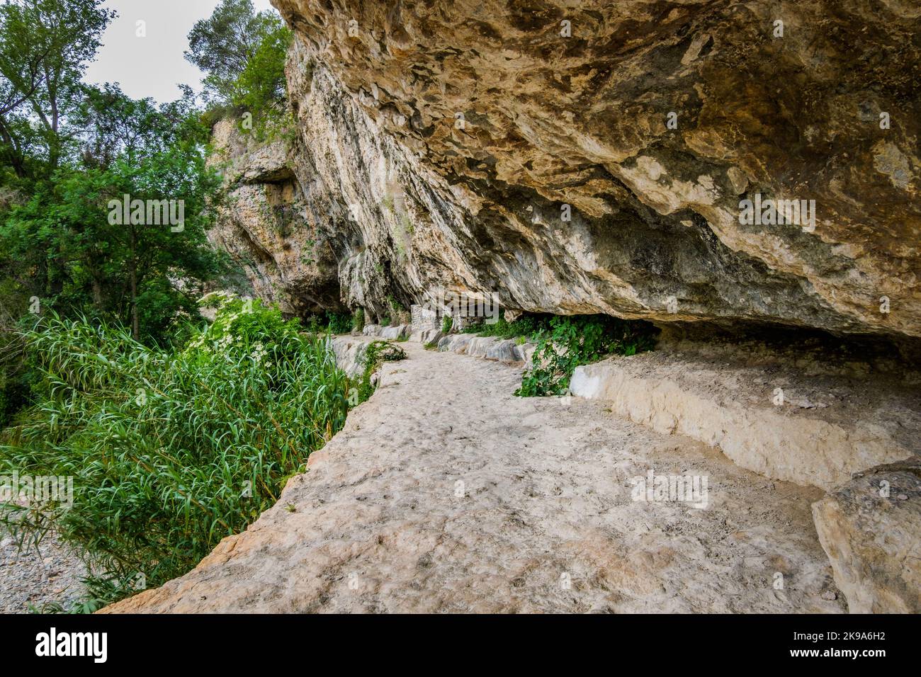 Hiking path near the cliff in a gorge near the medieval village of ...