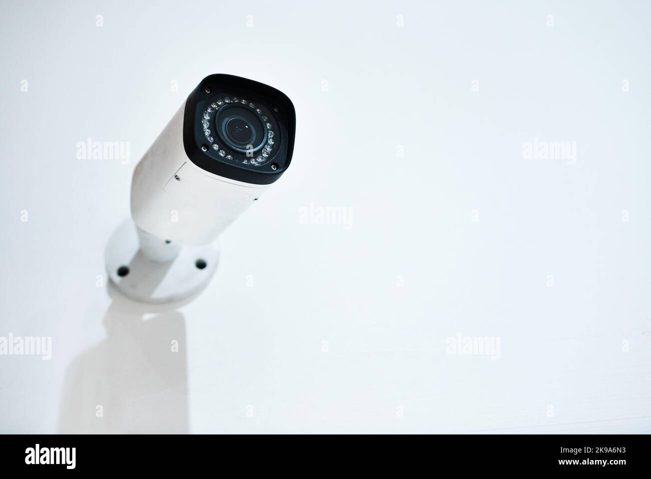 We have an eye for trouble. Low angle shot of a security camera mounted ...