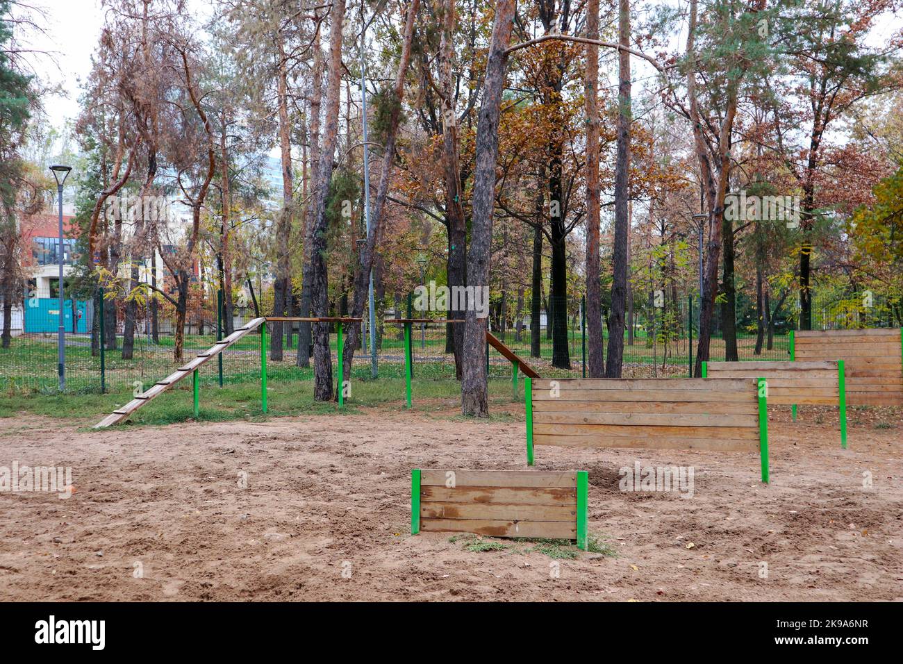 an empty dog playground in the fall. shells for practicing with a dog ...