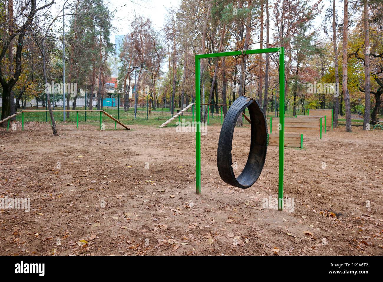 an empty dog playground in the fall. shells for practicing with a dog ...
