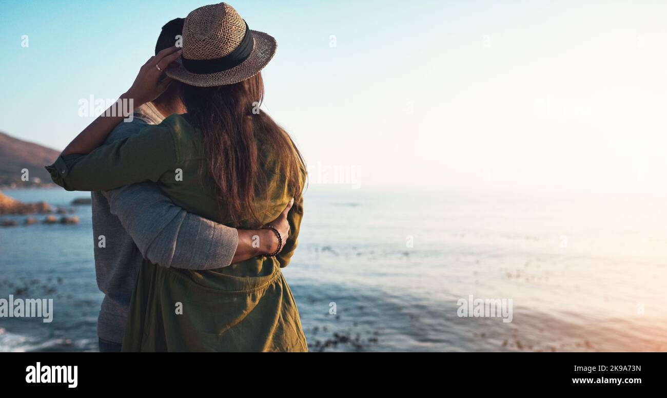 Summer days are for the seaside and bae. Rearview shot of an ...