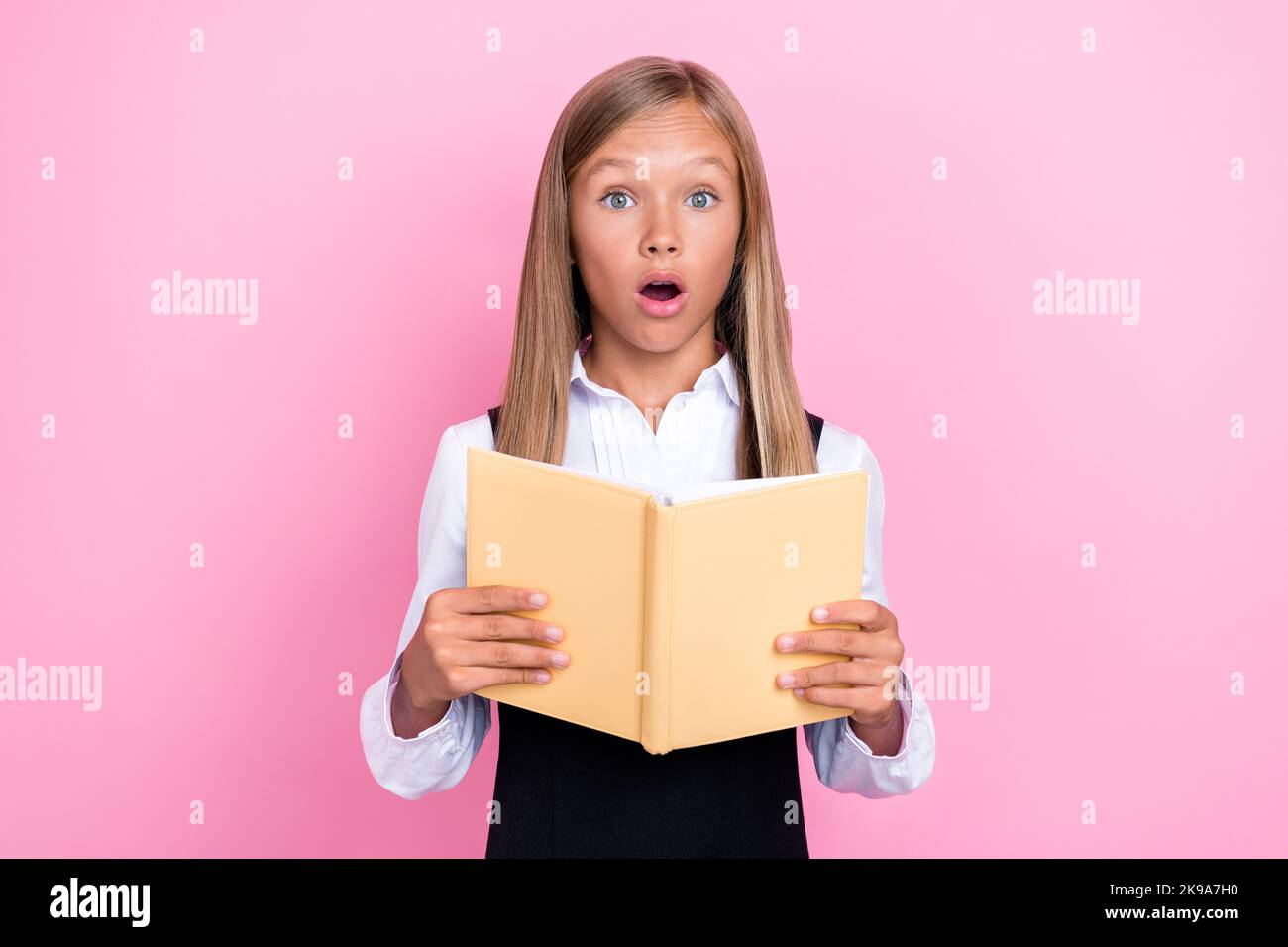 Photo of schoolkid learner open paper textbook impressed school ...