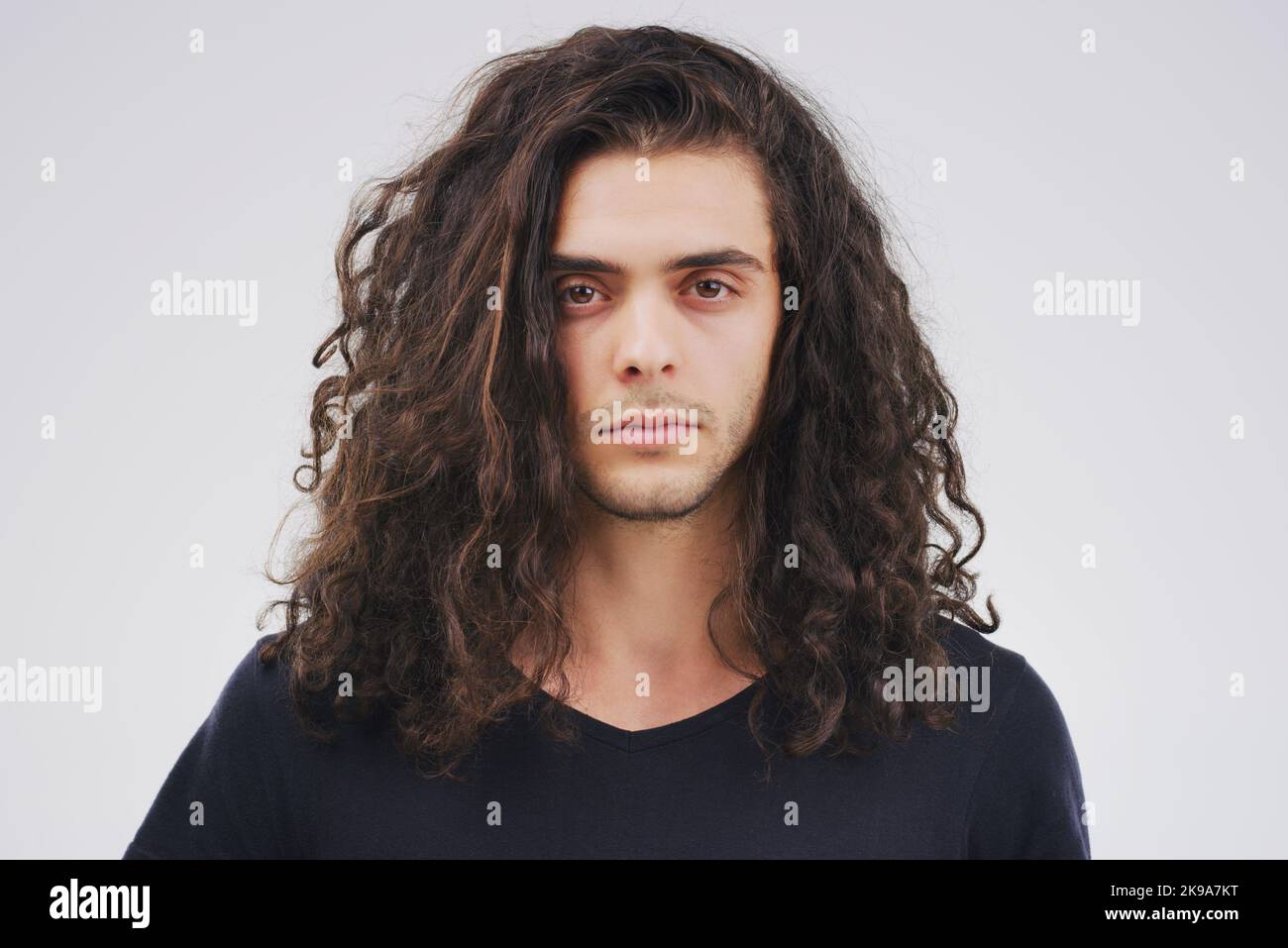 Hes difficult to read. Studio portrait of a handsome young man posing ...