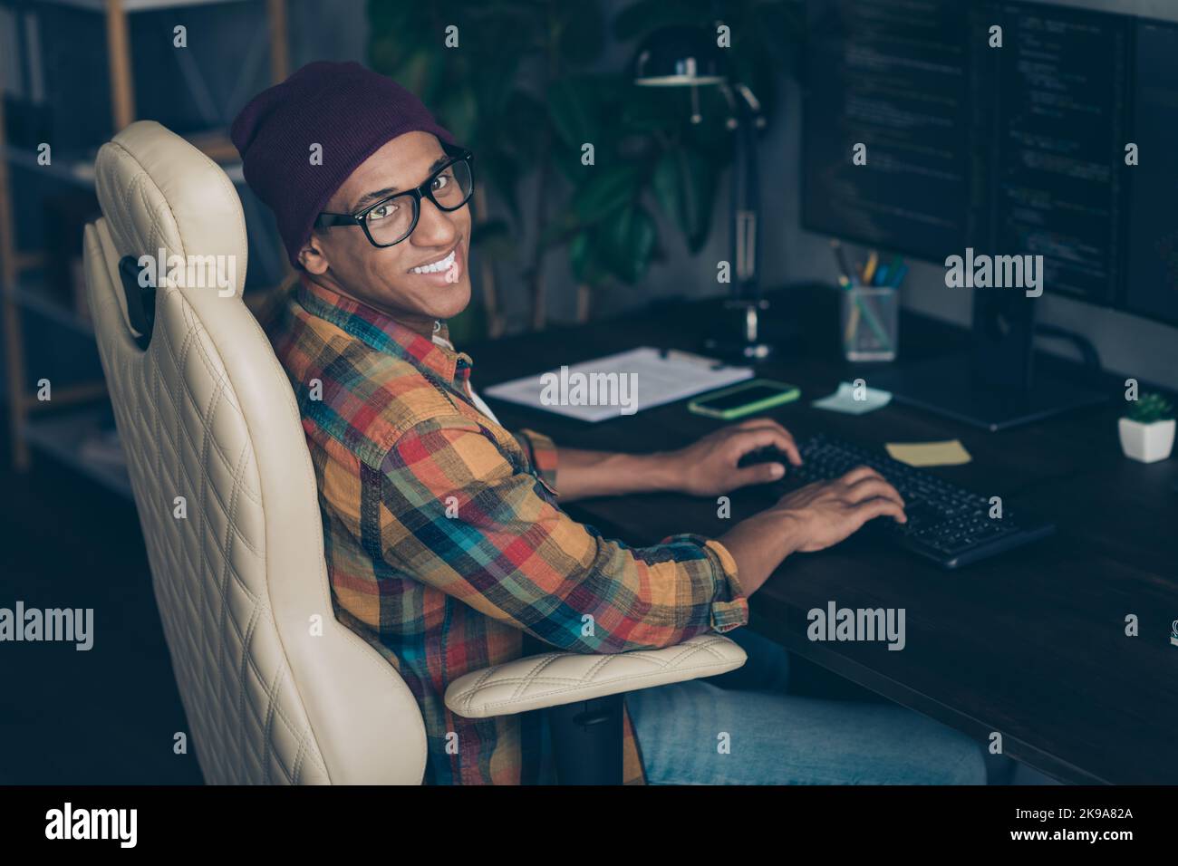 Profile photo of cheerful handsome guy sitting chair keyboard typing ...