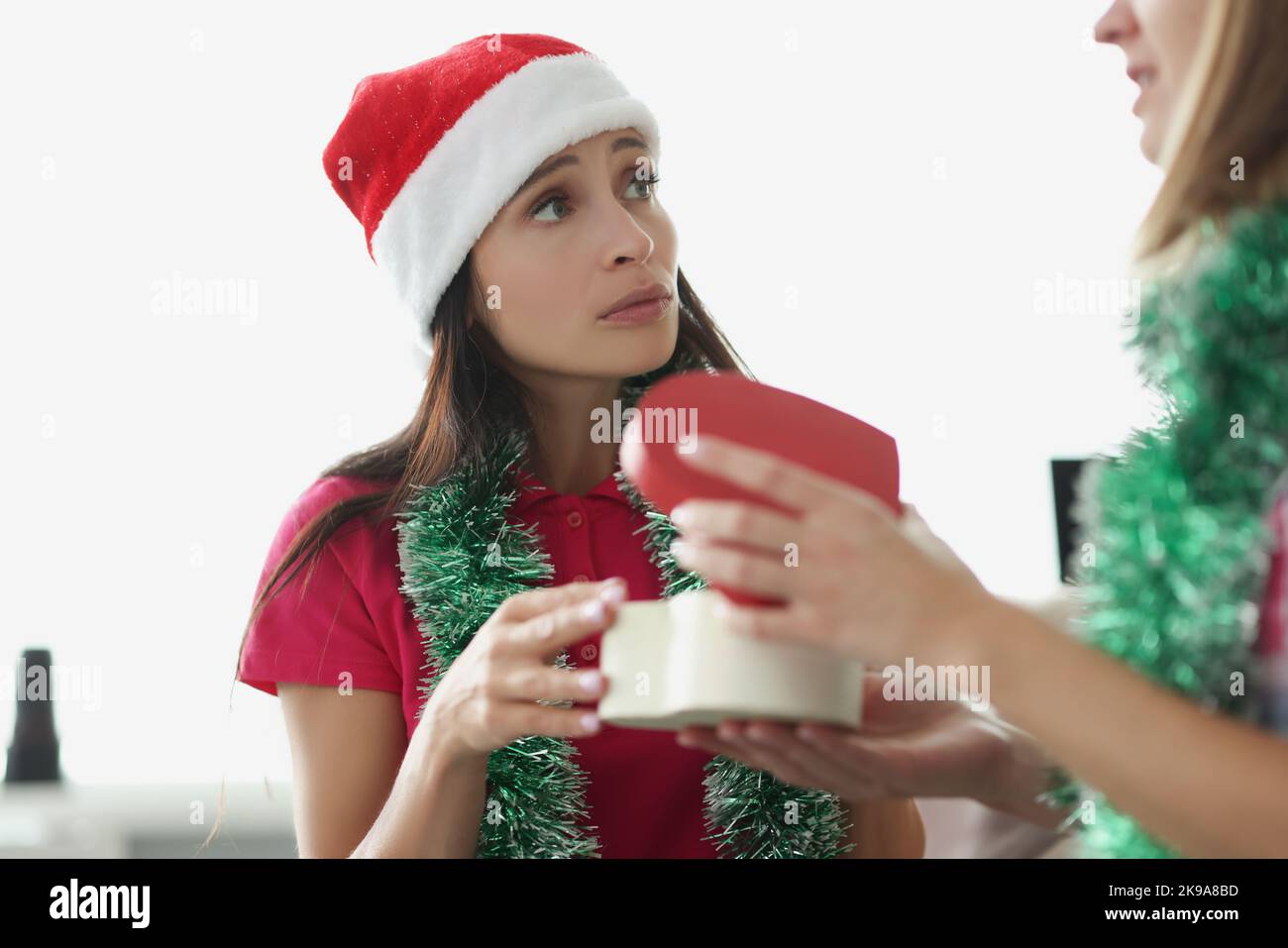Woman in santa claus hat open empty box, no present, sad facial ...
