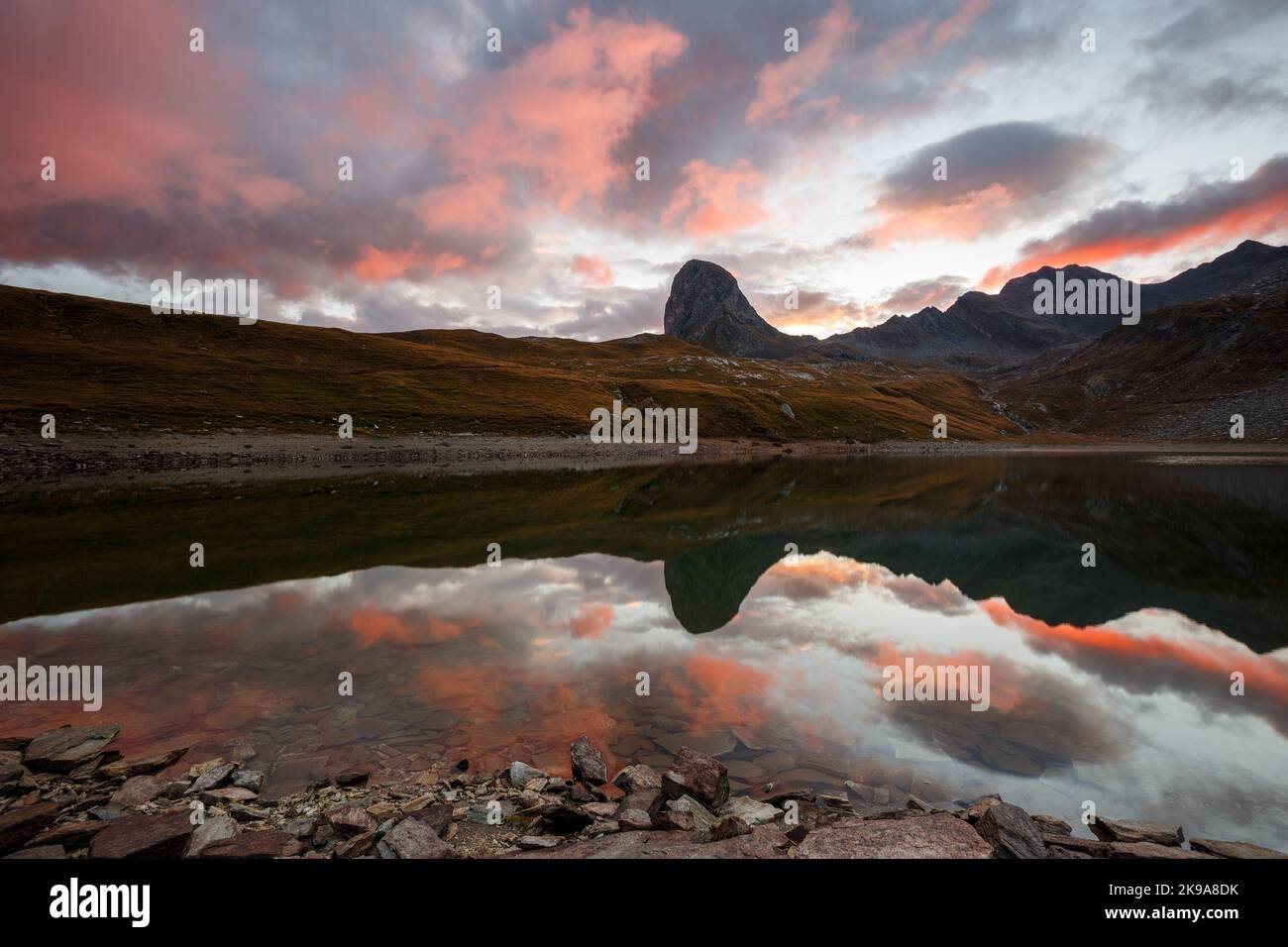 Reddish clouds at dawn. Bodensee alpine lake and Gösleswand mountain ...