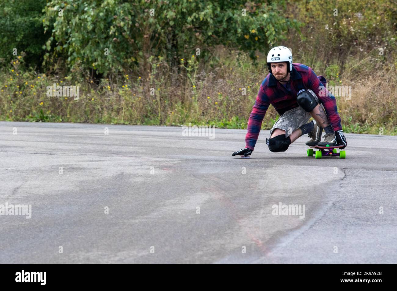 Skateboarder turning right on the Redbridge Cycling Centre track during ...