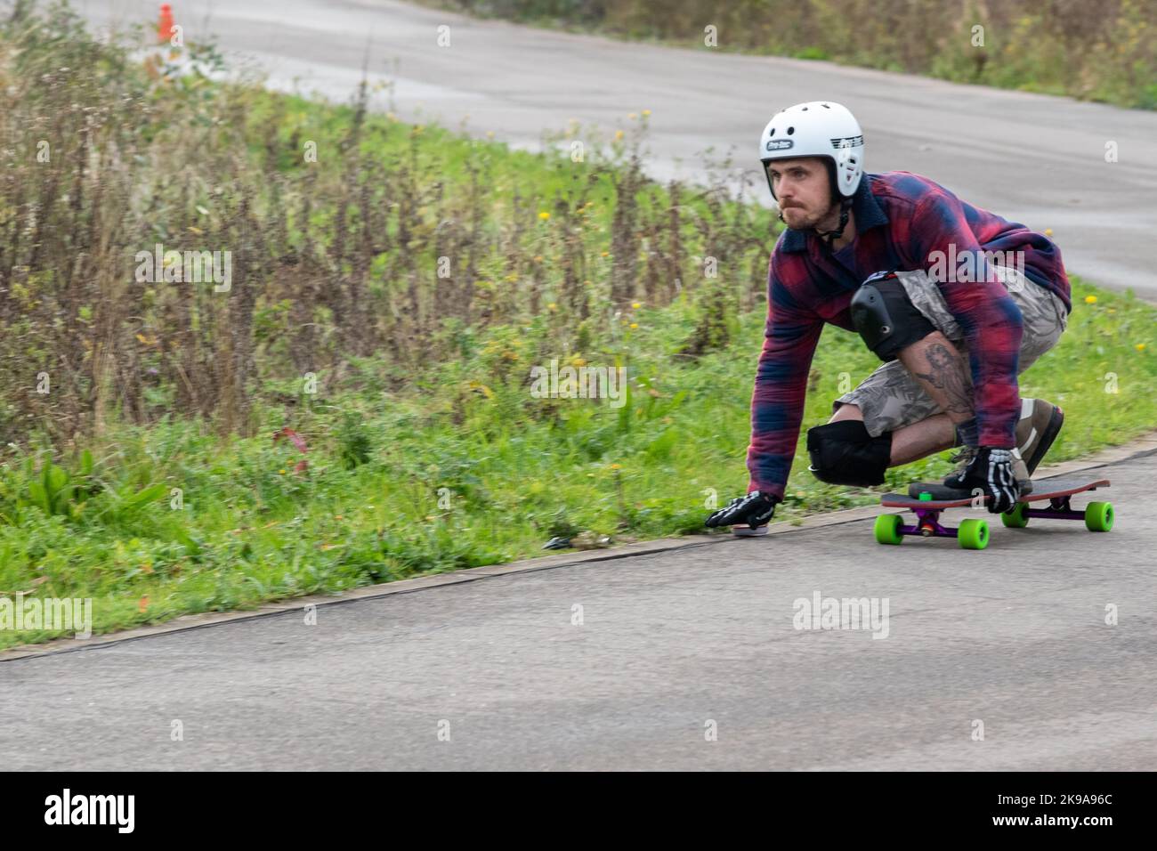 Skateboarder turning right on the Redbridge Cycling Centre track during ...