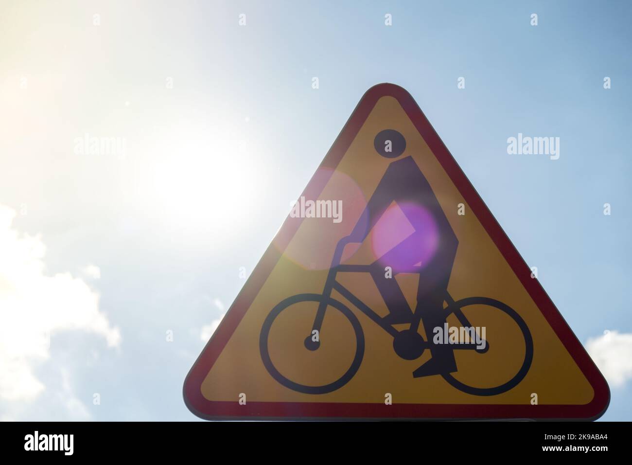 Triangle bicycle sign transit prohibited for bicycles on blurred park ...