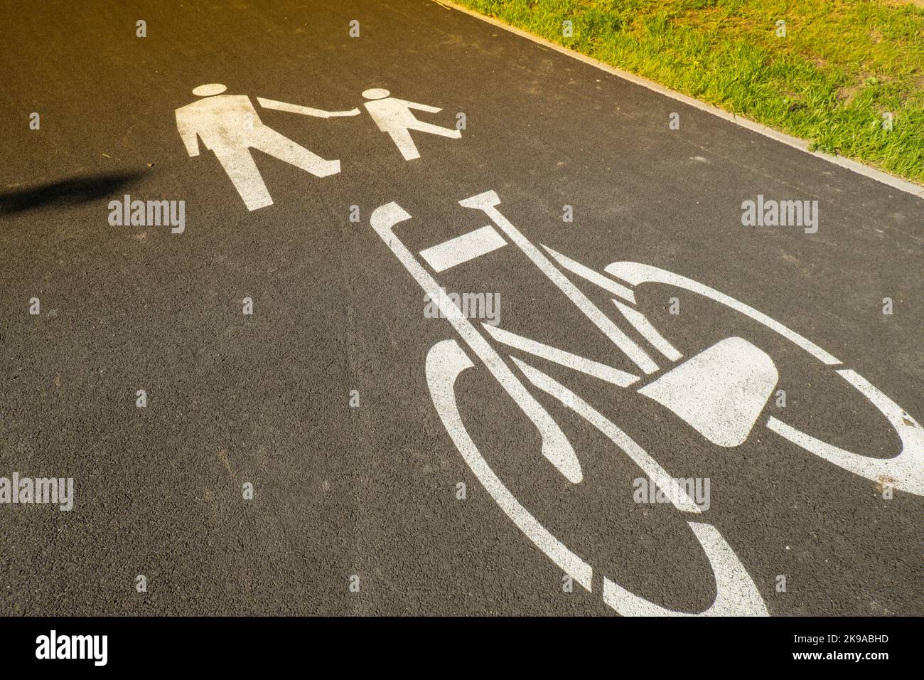 Cyclist and pedestrian route zone on a street. Painted Street Asphalt ...
