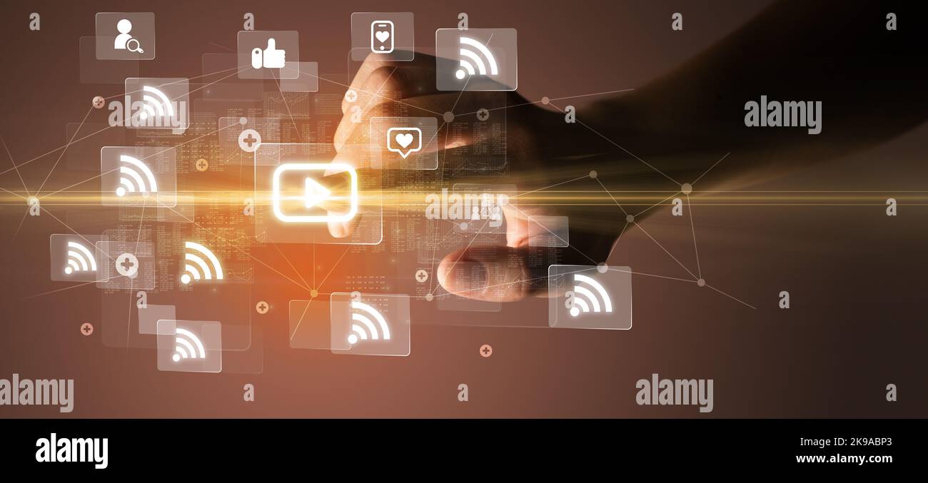 Hand pressing social media multimedia application screen with media ...