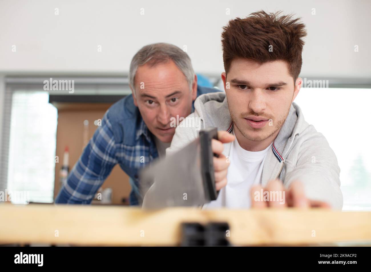 male apprentice carpenter learning the trade Stock Photo - Alamy