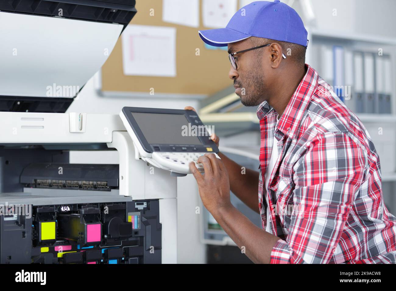 repairing a printer at work Stock Photo - Alamy