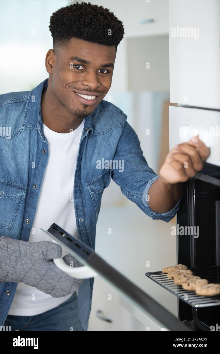 young man cooking in the kitchen Stock Photo - Alamy