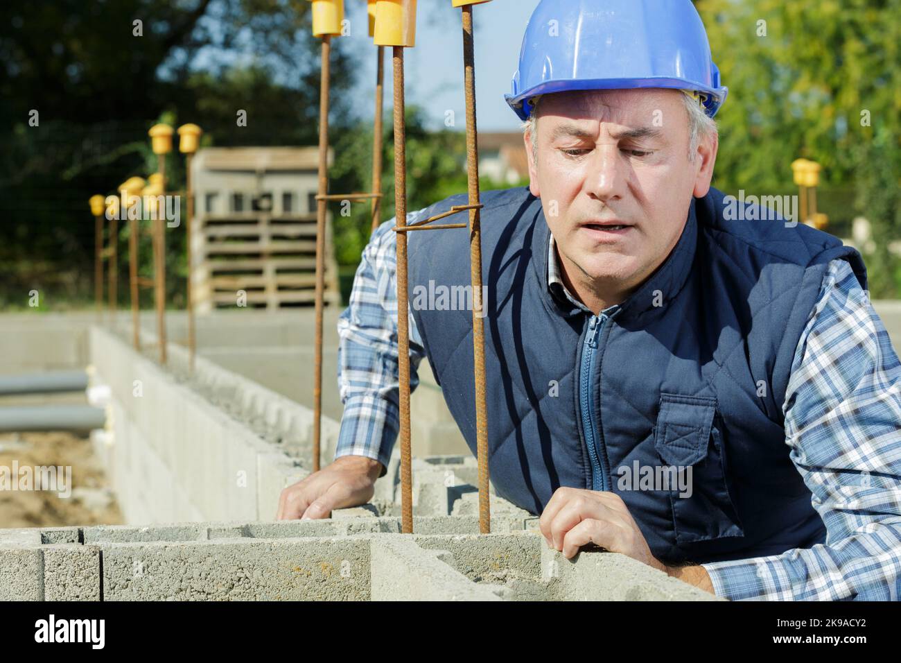construction worker dealing with structure works Stock Photo - Alamy