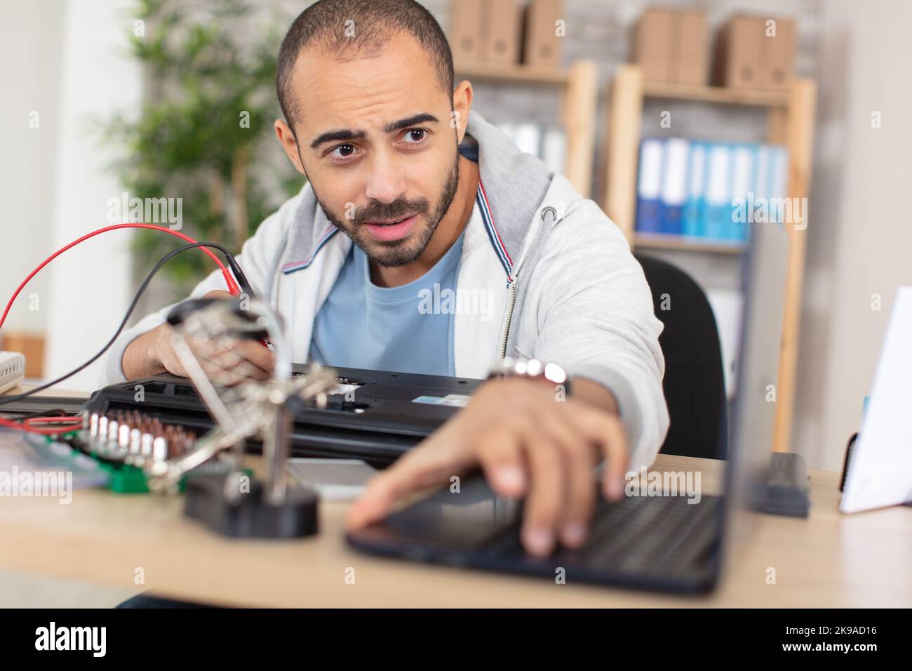 concentrated engineer working with laptop Stock Photo - Alamy