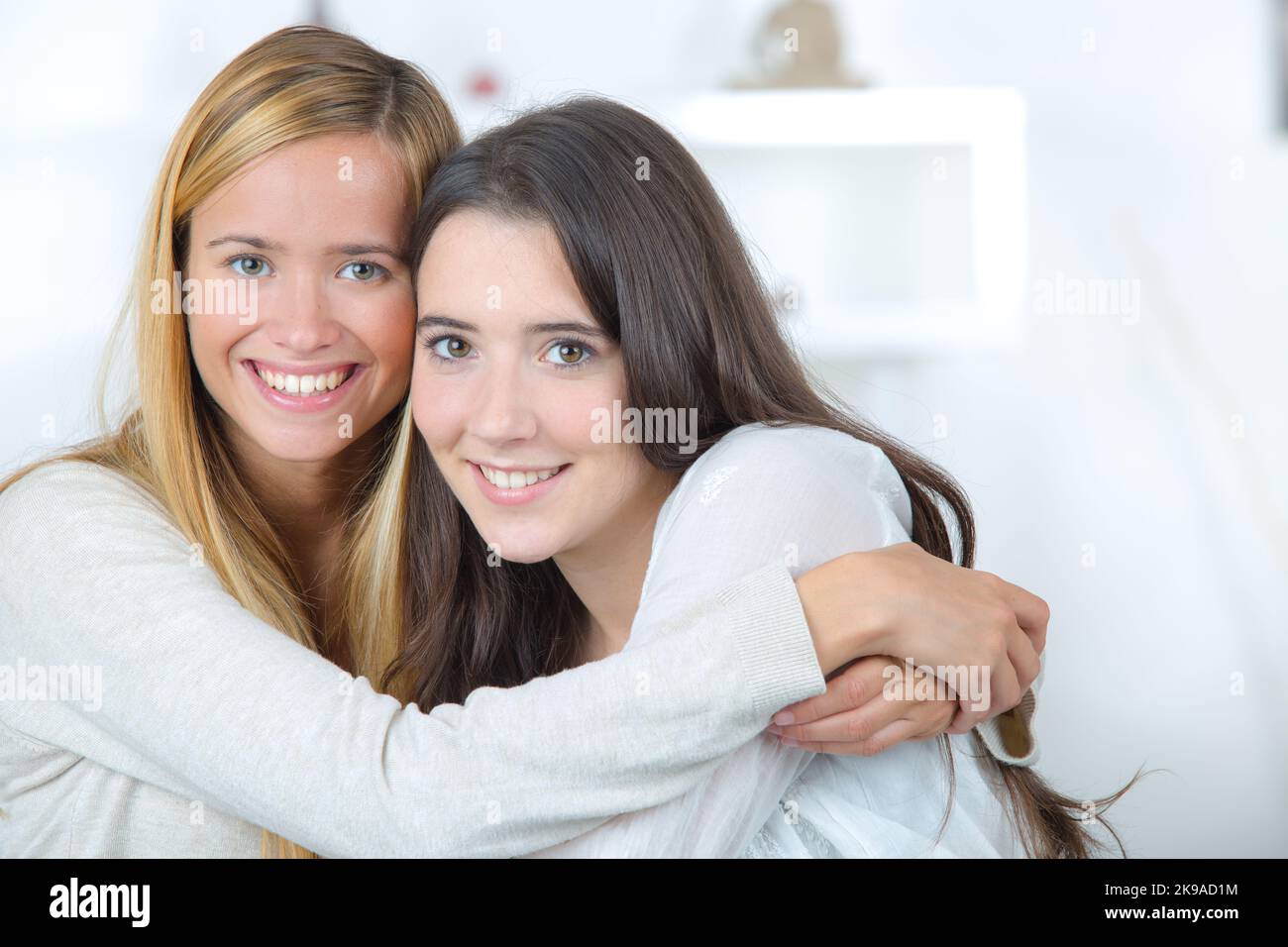 best friends are hugging in front of the camera Stock Photo - Alamy