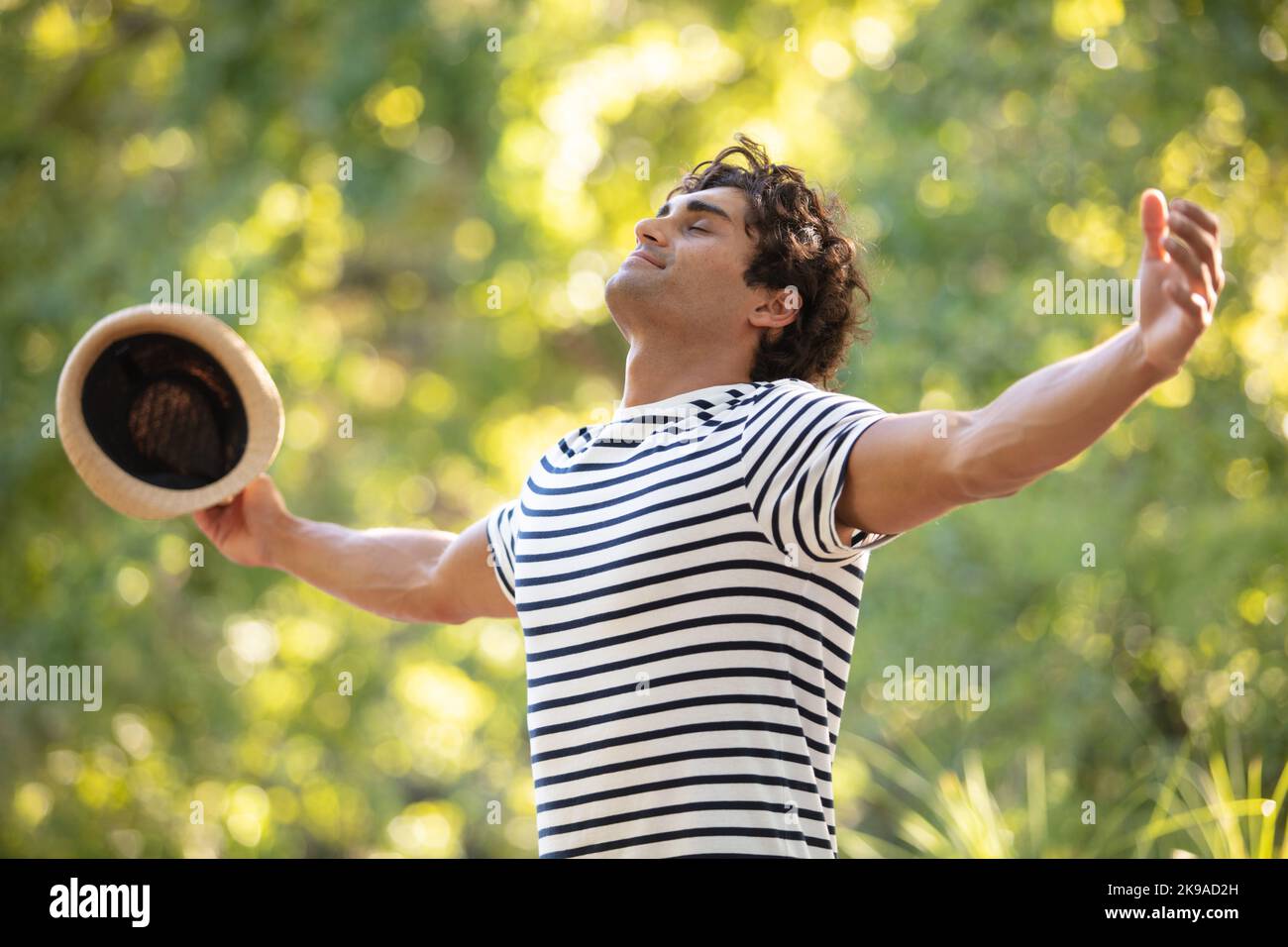 emotional young man laughing in wind Stock Photo - Alamy