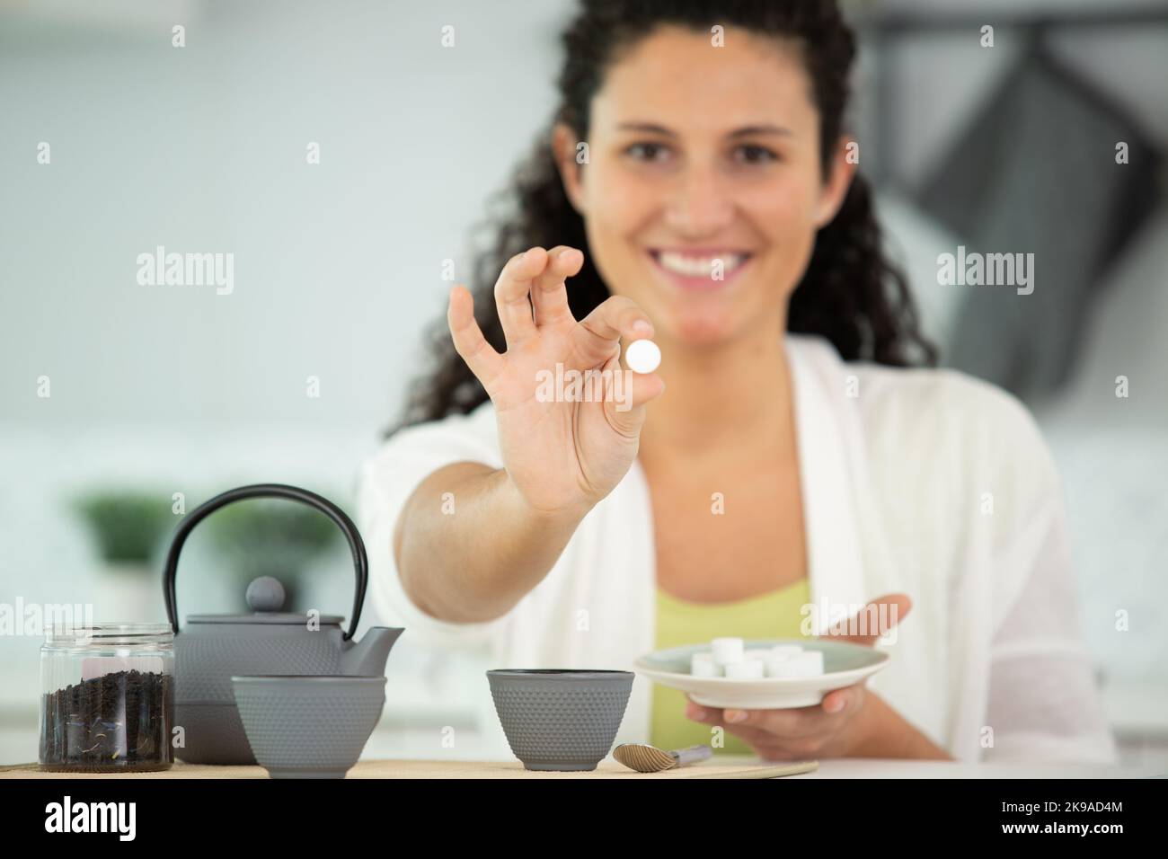 Adding sweetener hi-res stock photography and images - Alamy