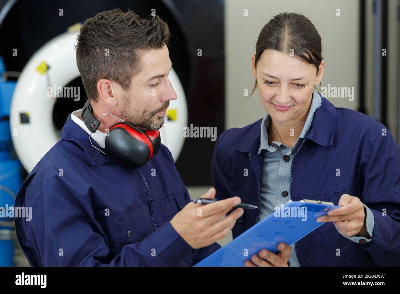 female aero engineer working on helicopter in hangar Stock Photo - Alamy