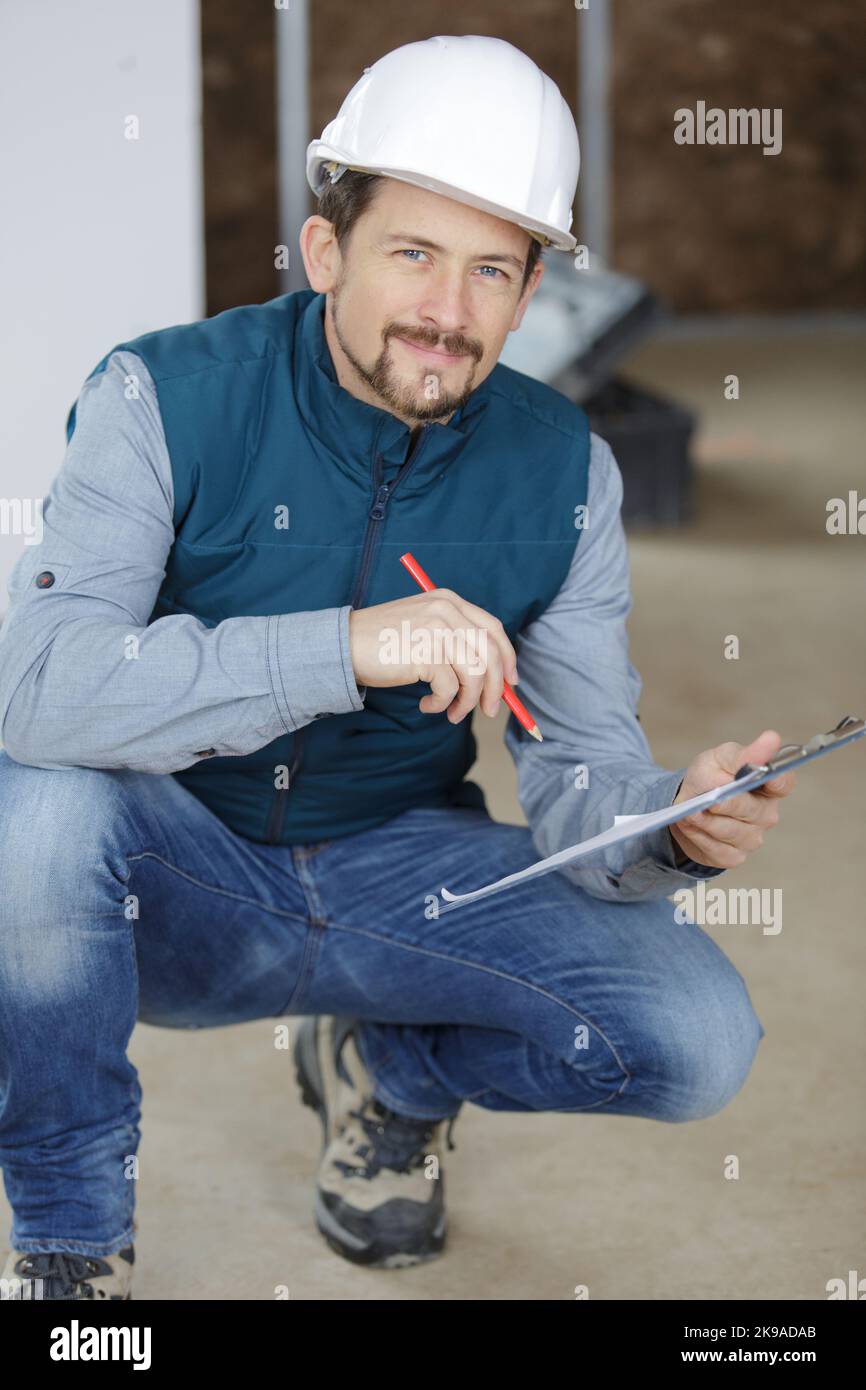 happy builder in a construction site Stock Photo - Alamy