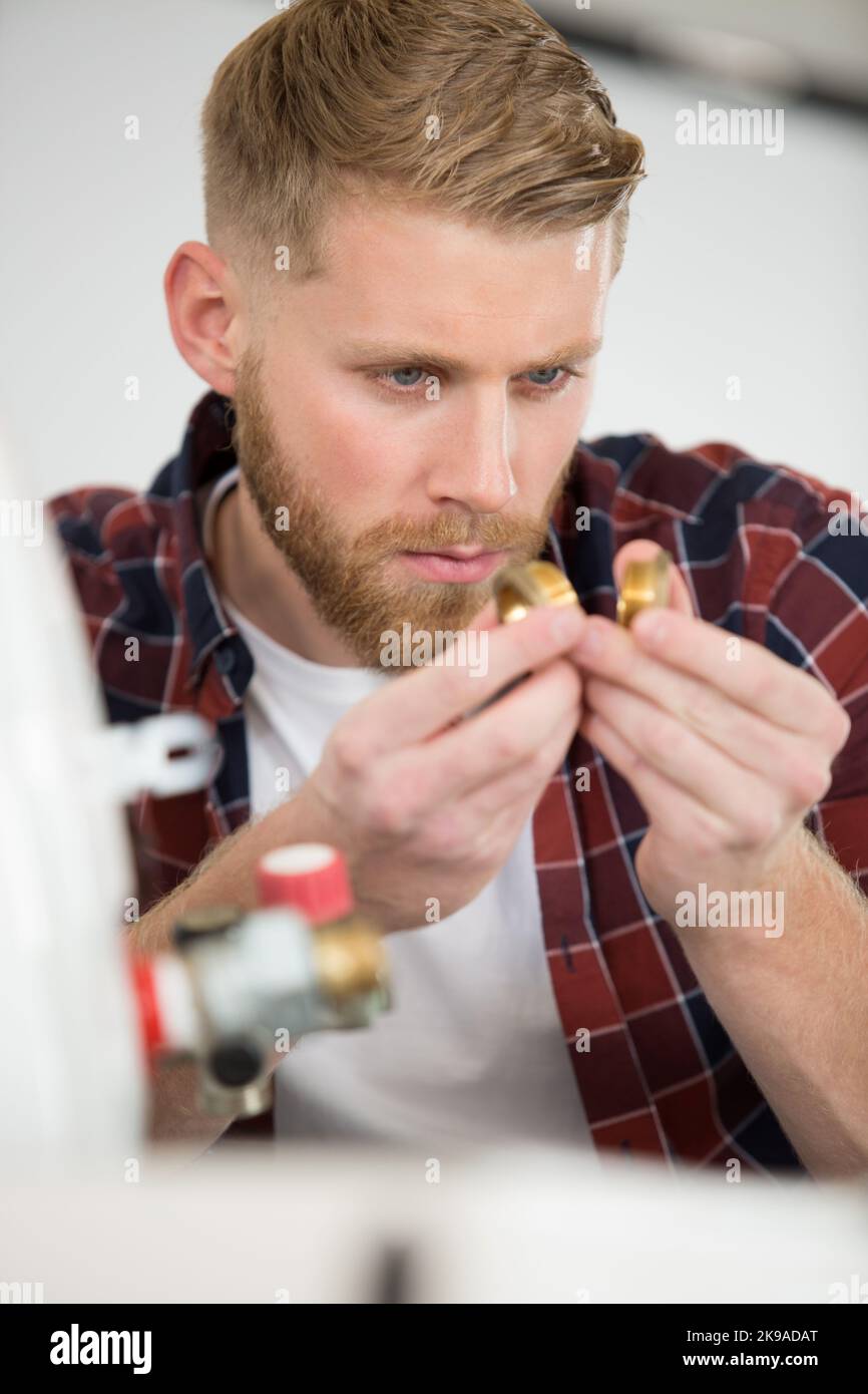 worker set up central gas heating boiler at home Stock Photo - Alamy