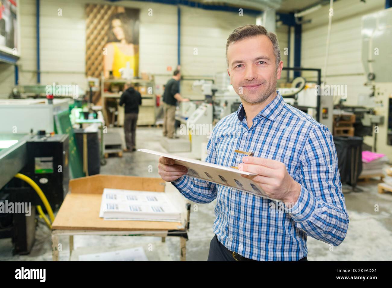 billboard and advertising agency worker Stock Photo - Alamy