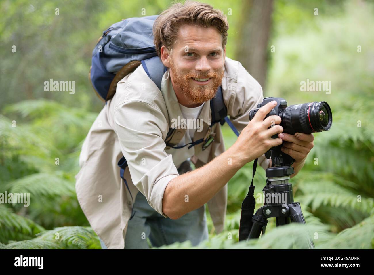 happy photographer is taking photos outdoors Stock Photo - Alamy