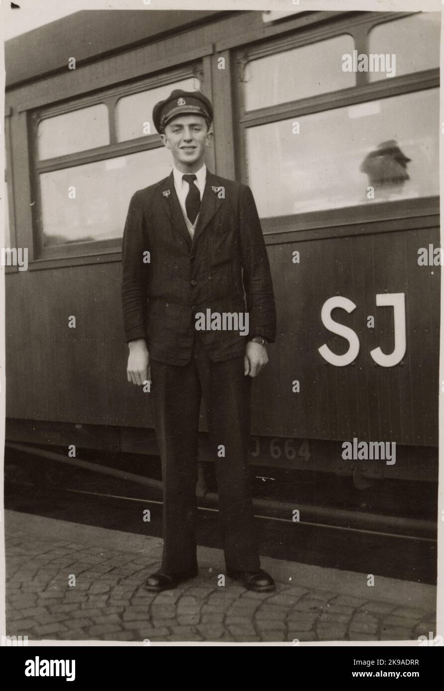 Knut Claesson in front of a state railways, SJ passenger car with ...