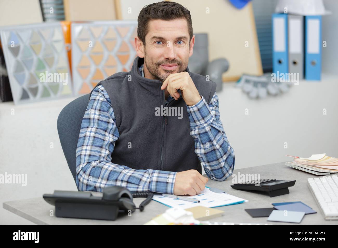 male worker choosing a color Stock Photo - Alamy