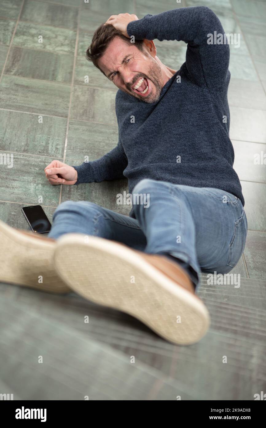 man suffering head injury after falling down some stairs Stock Photo ...