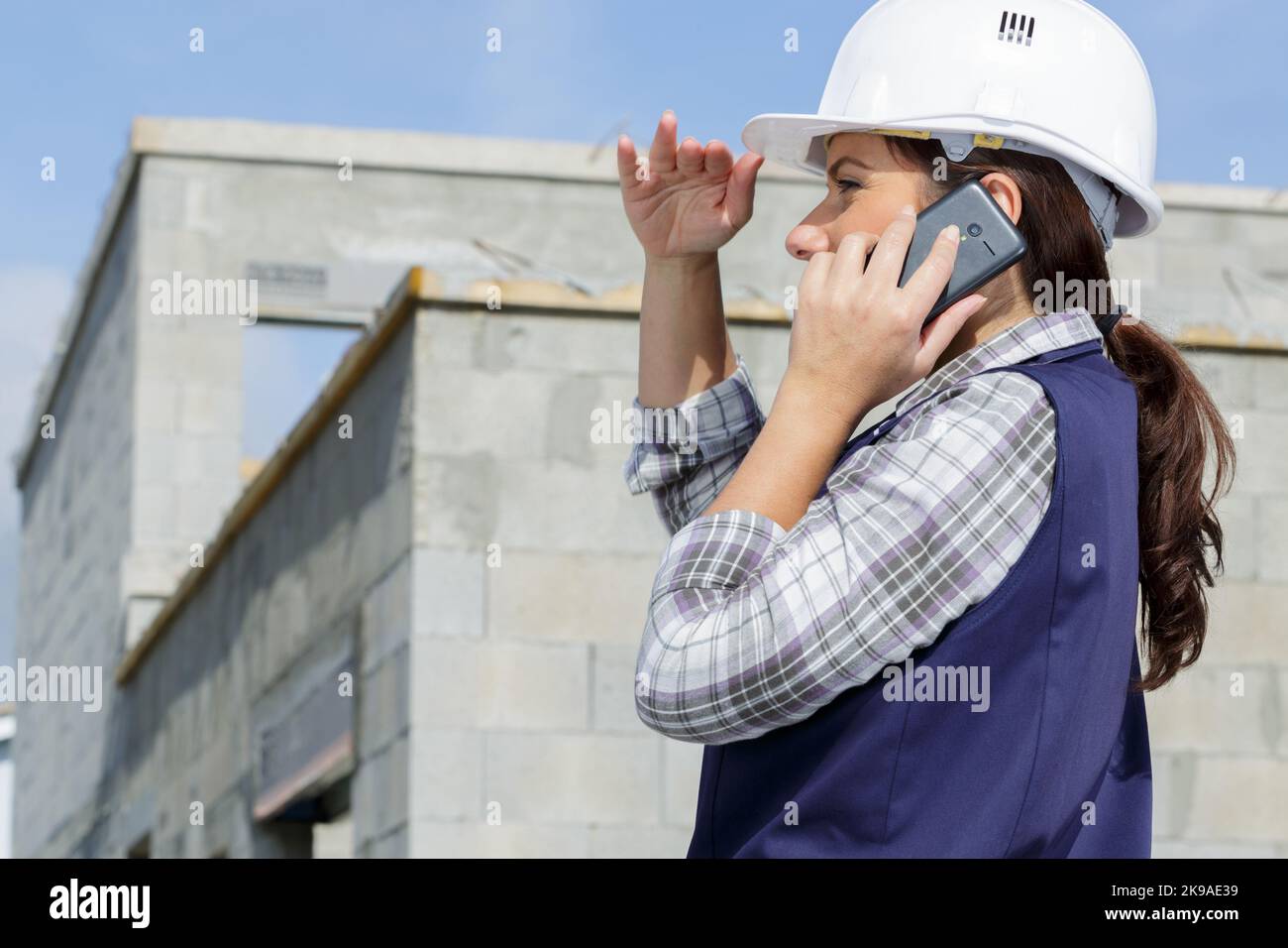 Female contractor talking on mobile hi-res stock photography and images ...