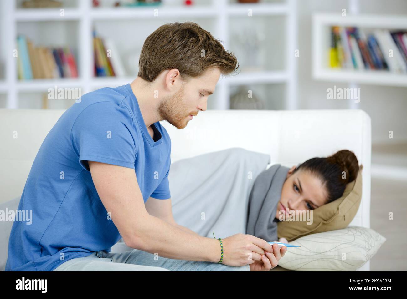 husband taking care of the sick wife Stock Photo - Alamy