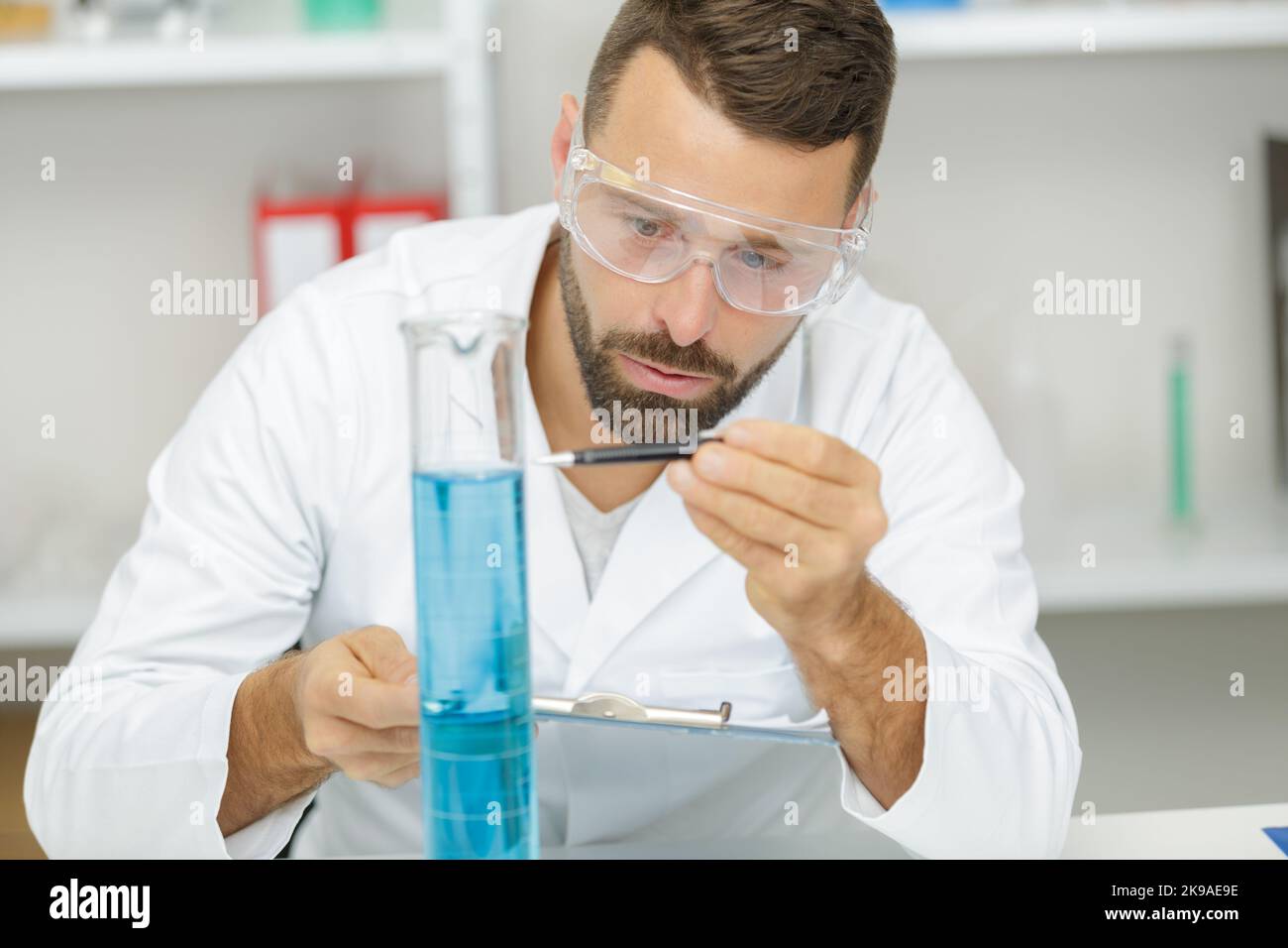 portrait of a man over experiment Stock Photo - Alamy