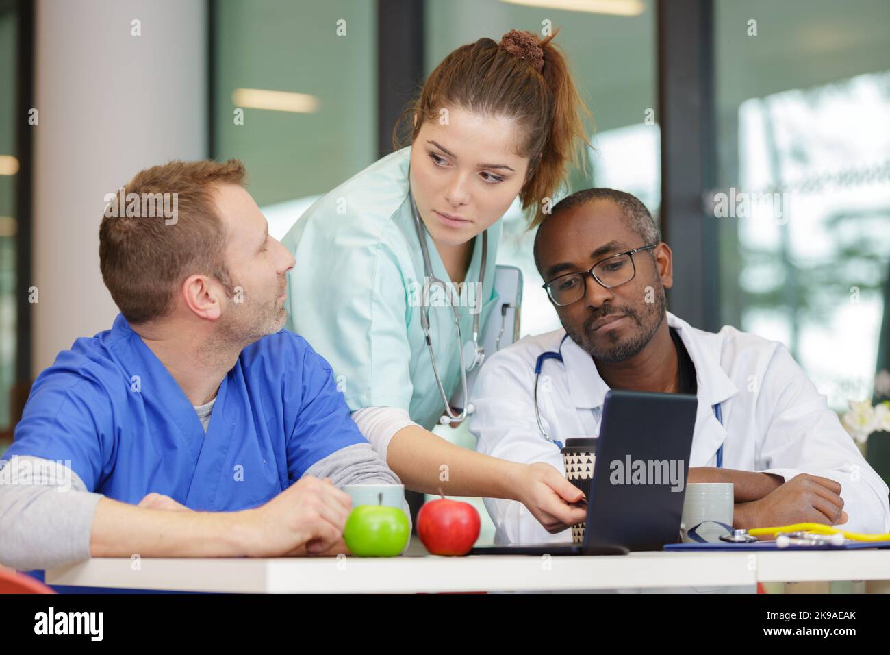 medical team of doctors checking the pc at lunch Stock Photo - Alamy
