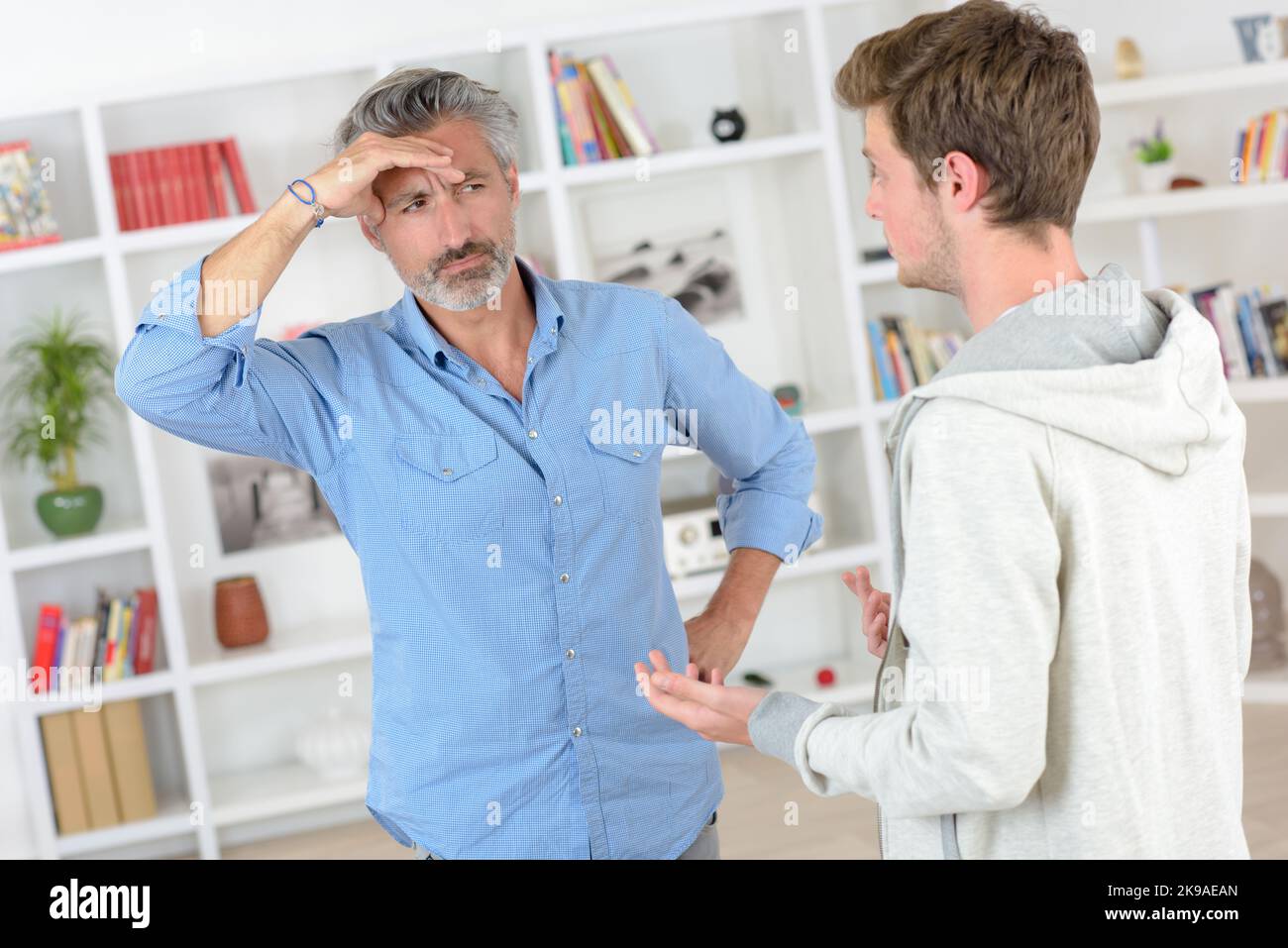 Argument between father and son Stock Photo - Alamy