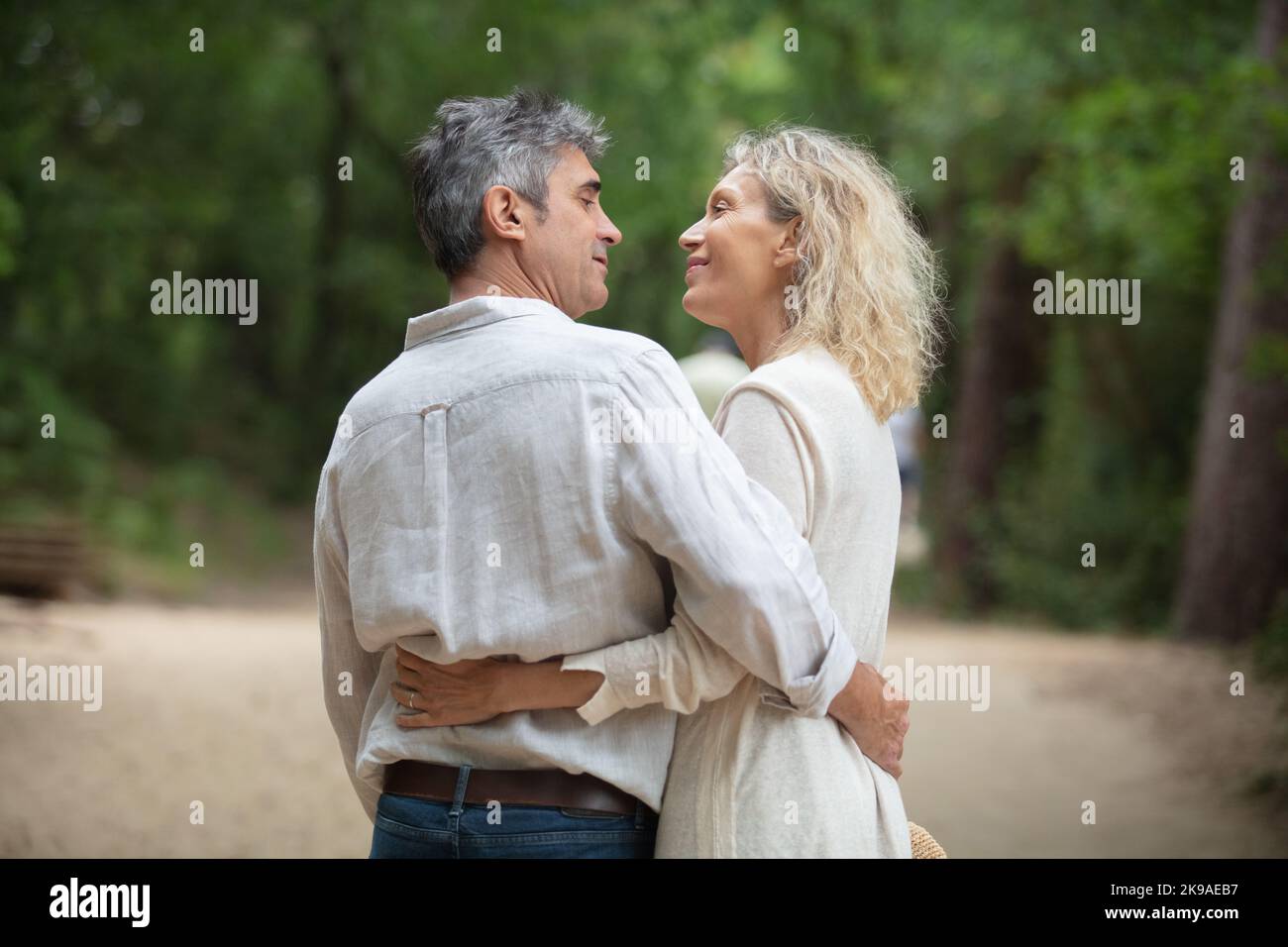 cute middle aged couple embracing outdoors Stock Photo - Alamy