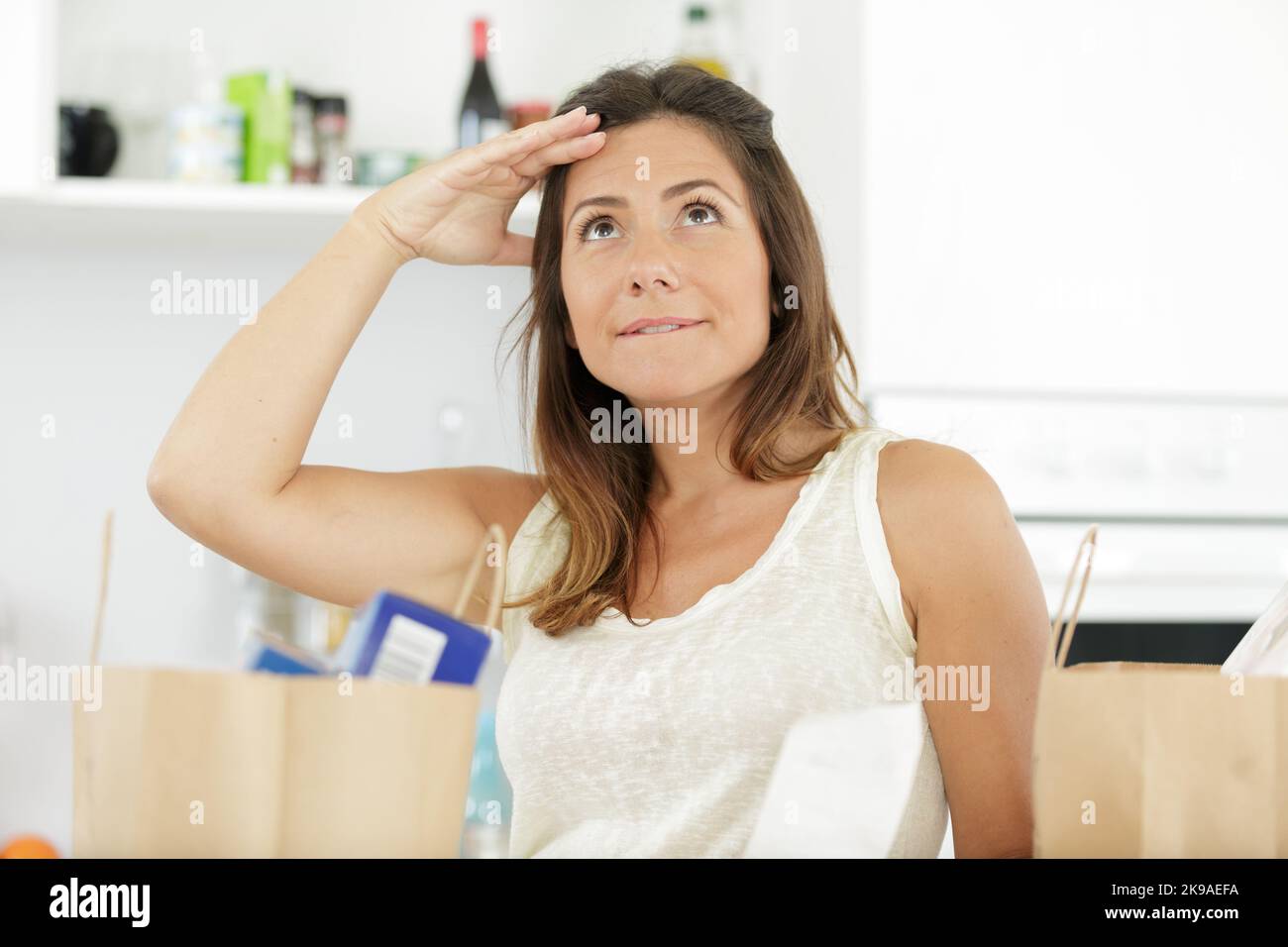 woman forgot something in the supermarket Stock Photo - Alamy