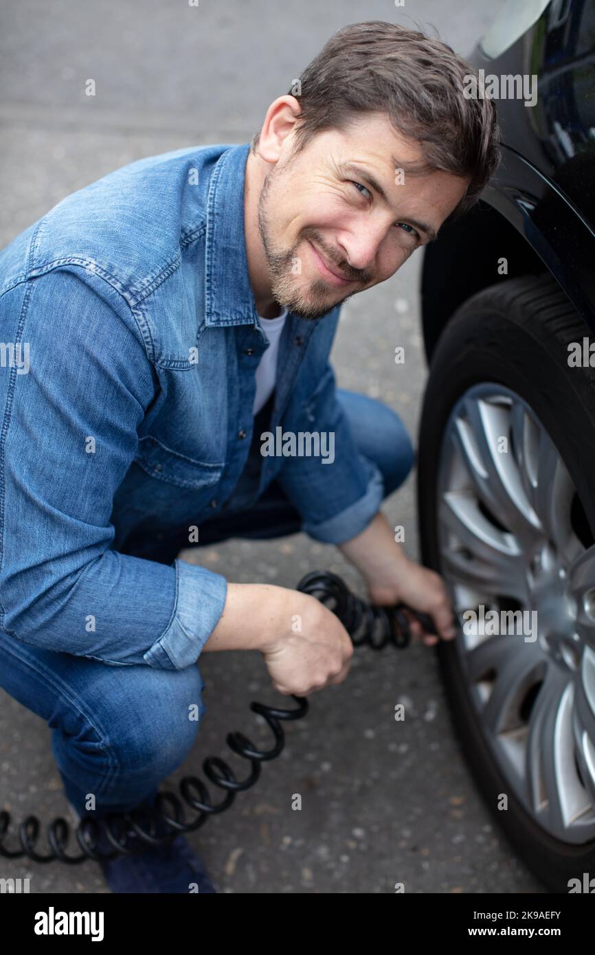 man car inspection measure quantity inflated rubber tires car Stock ...