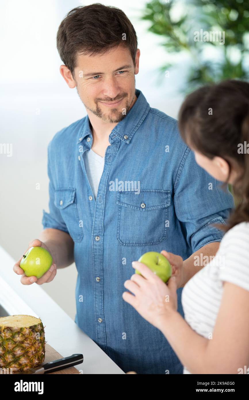 Woman feeding fruits man hi-res stock photography and images - Alamy
