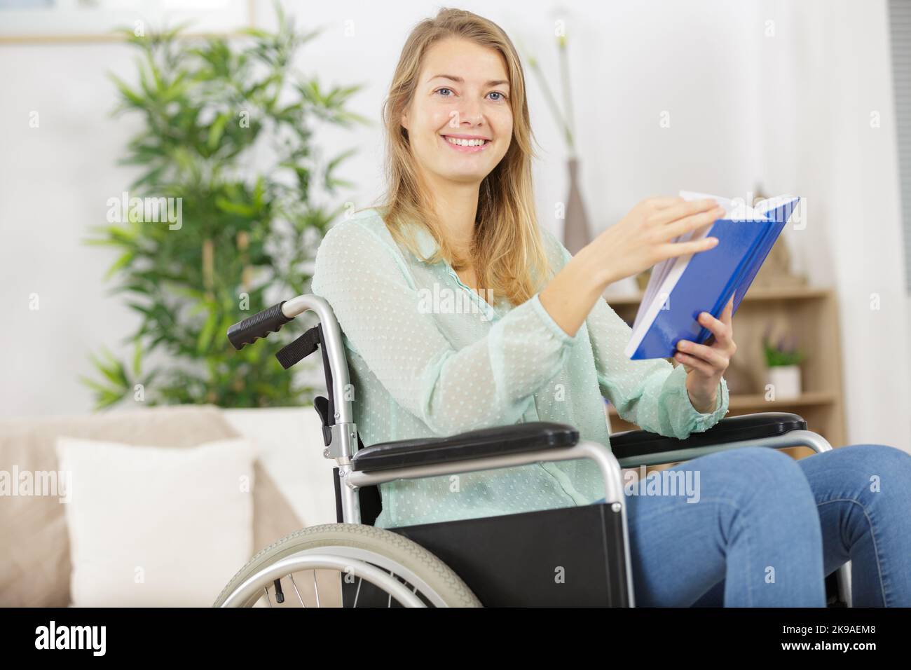 disabled woman reading a book Stock Photo - Alamy