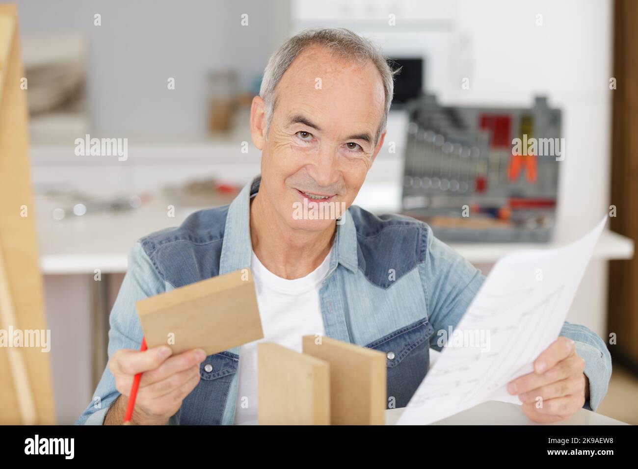 senior wood carving professional during work Stock Photo - Alamy