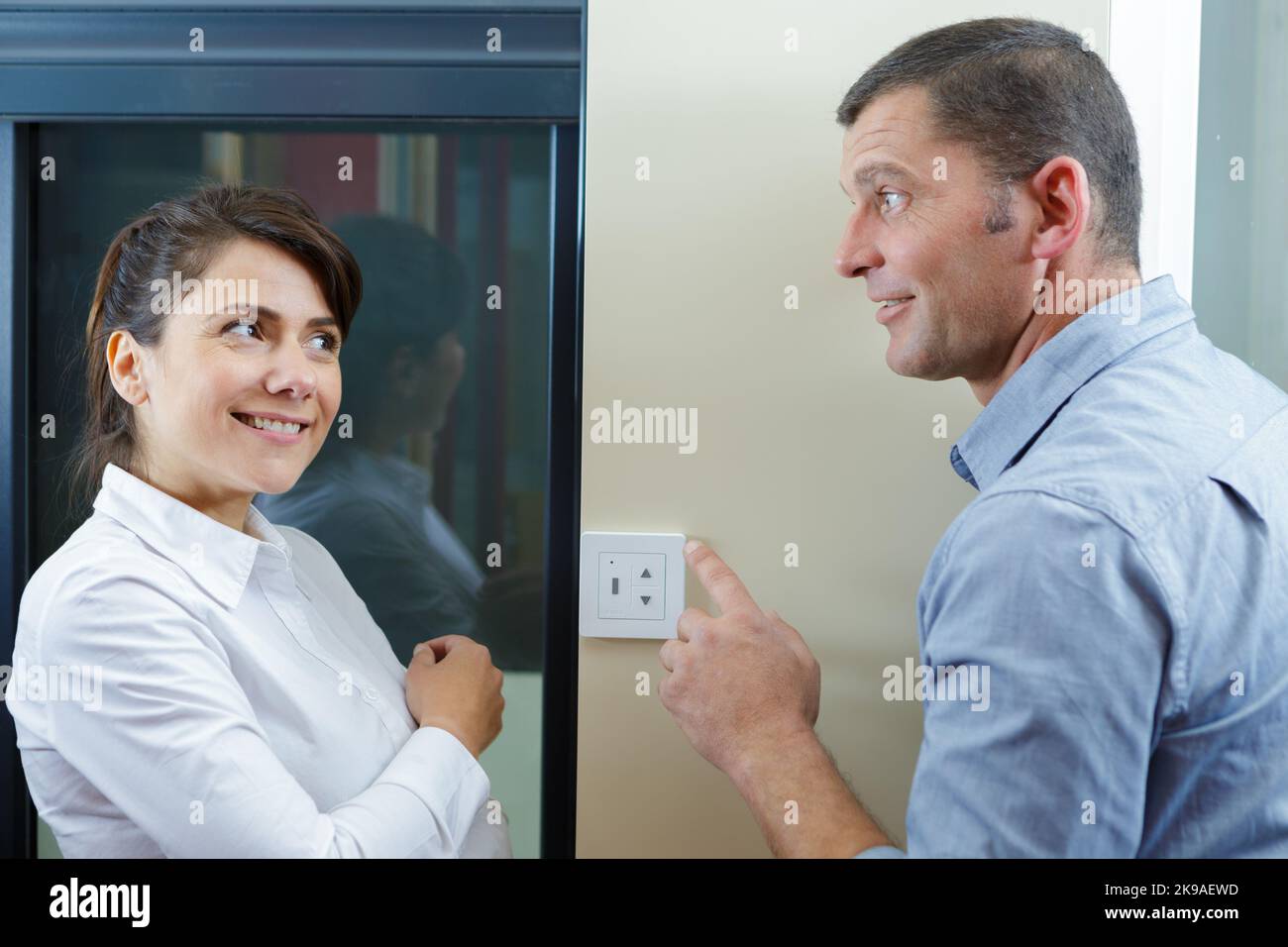 couple next to electric switch Stock Photo - Alamy